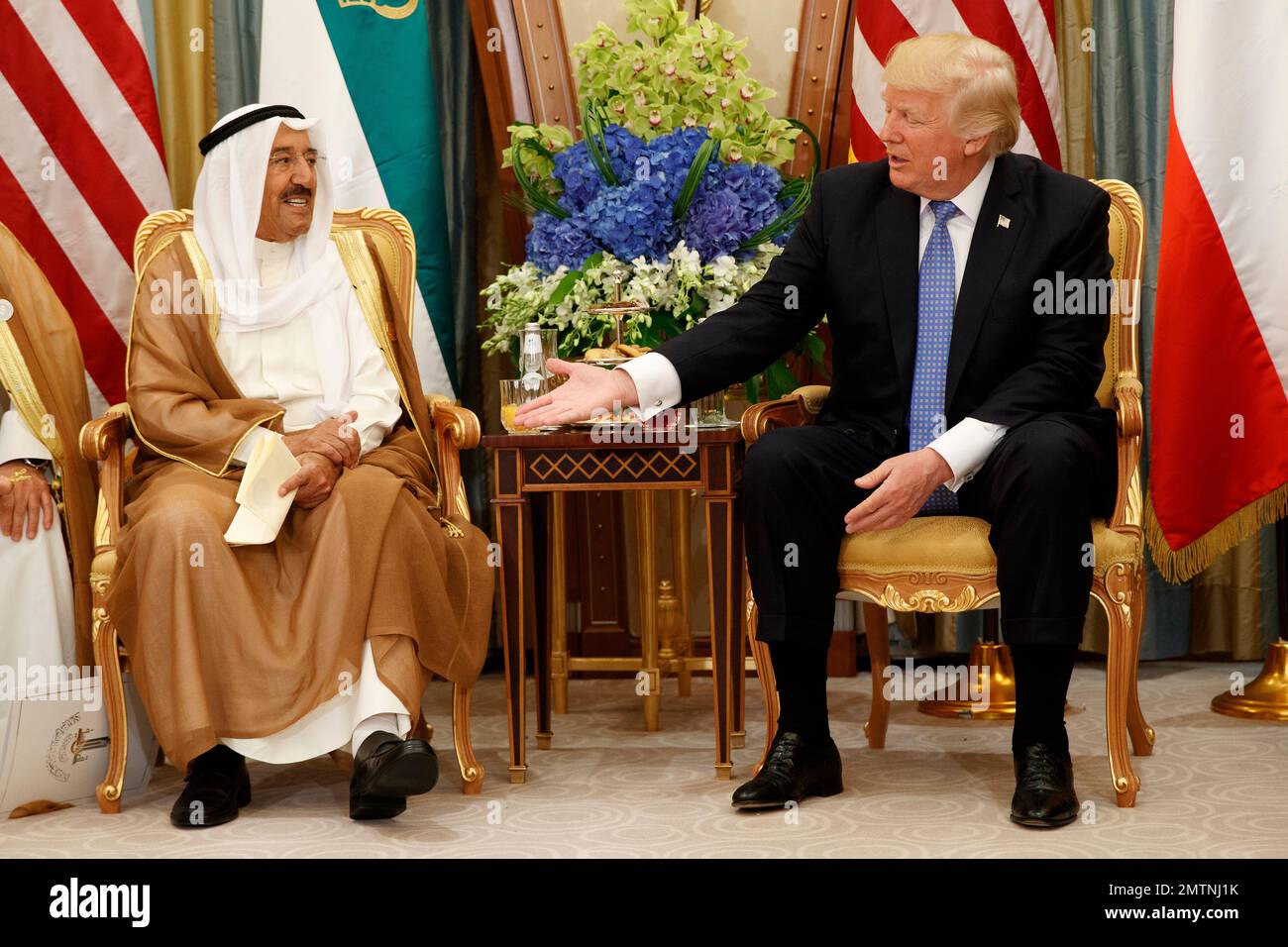 President Donald Trump shakes hands with Kuwait's Emir Shaikh Sabah Al Ahmad Al Sabah during a ...
