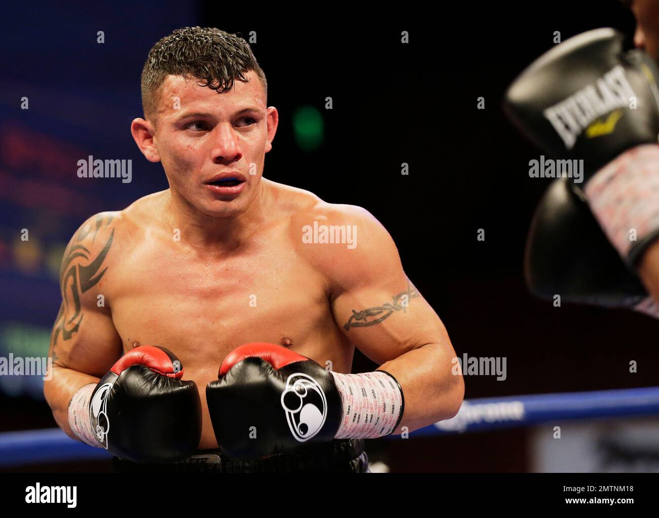 Oscar Escandon approaches Gary Russell Jr. during the WBC featherweight ...