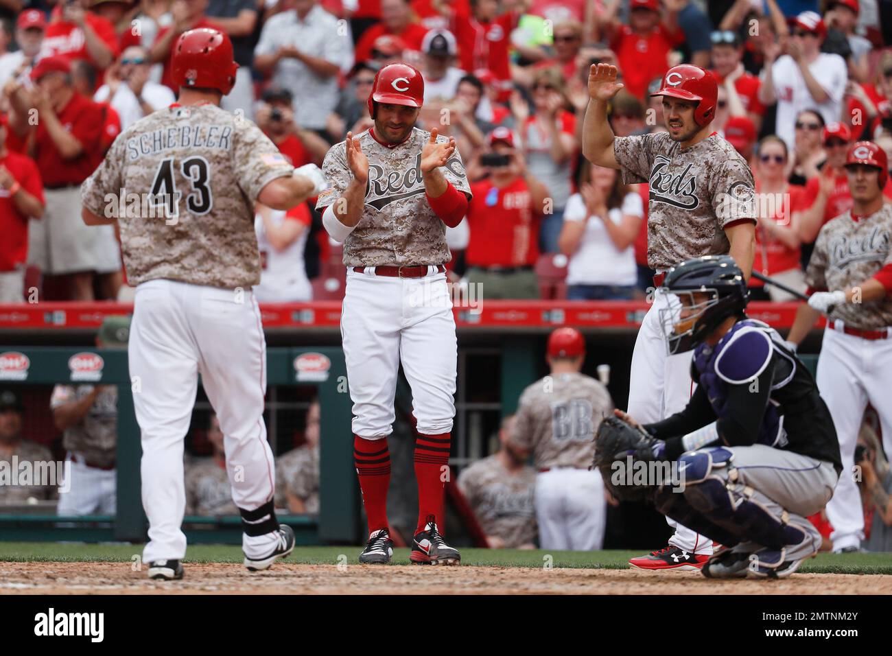 Cincinnati Reds' Scott Schebler (43) celebrates with Joey Votto, center ...