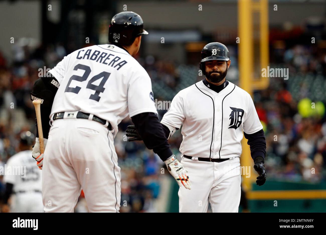 Detroit Tigers' Alex Avila, right, celebrates his solo home run against ...
