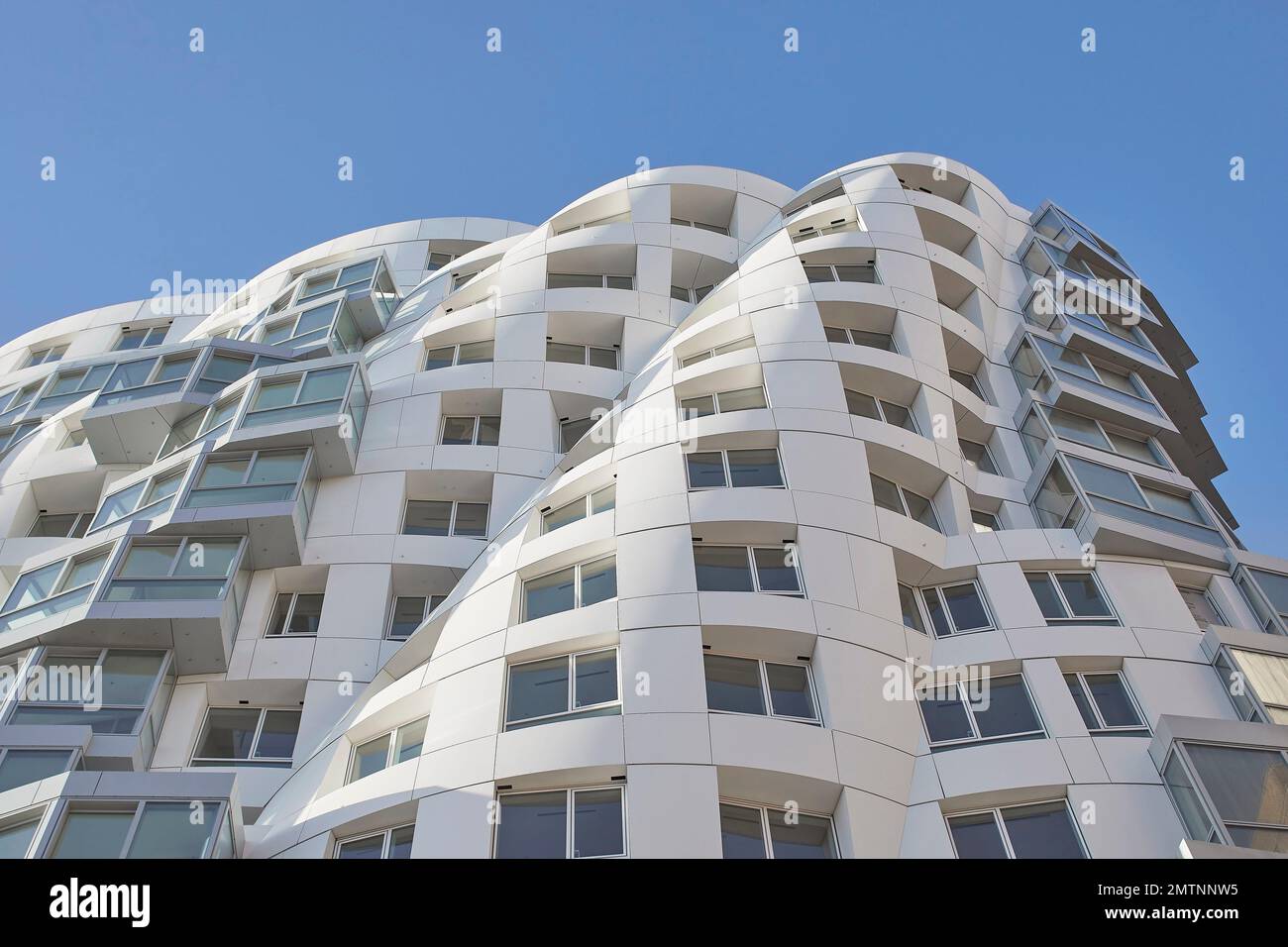 Looking skywards along white facade. Prospect Place Battersea Power ...
