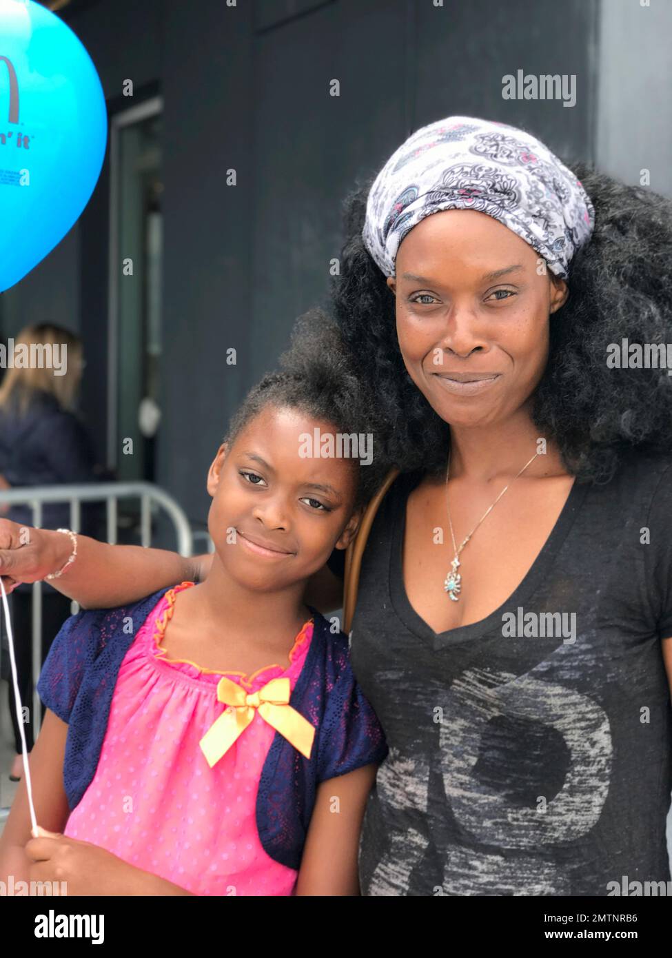 Clarissa Williams, of West Hempstead, N.Y., poses with her daughter ...