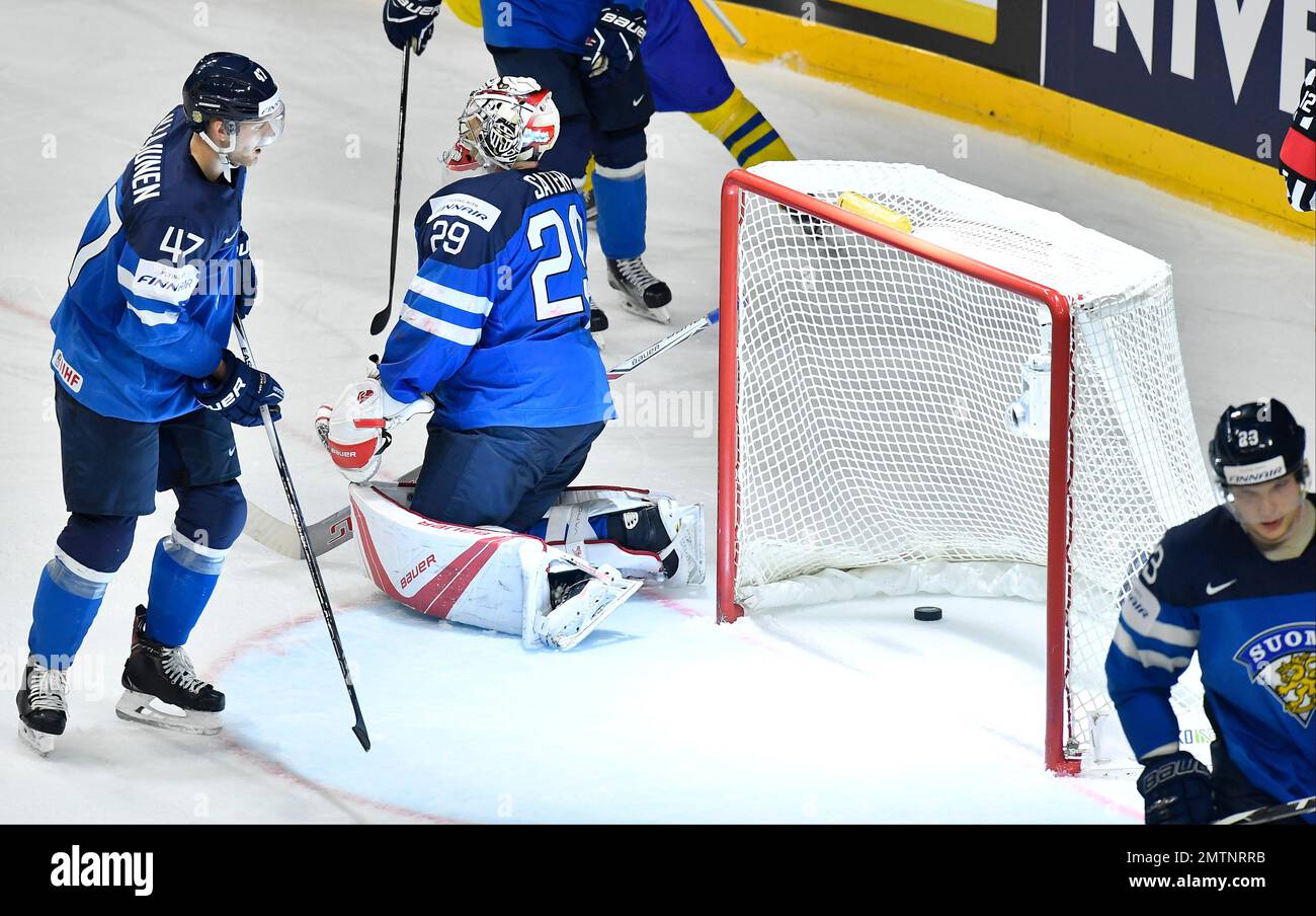 Finland's goalie Harri Sateri reacts after missing fourth goal during ...