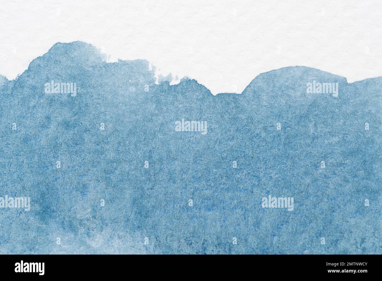 close-up soft stain liquid indigo deep blue water color on paper ...