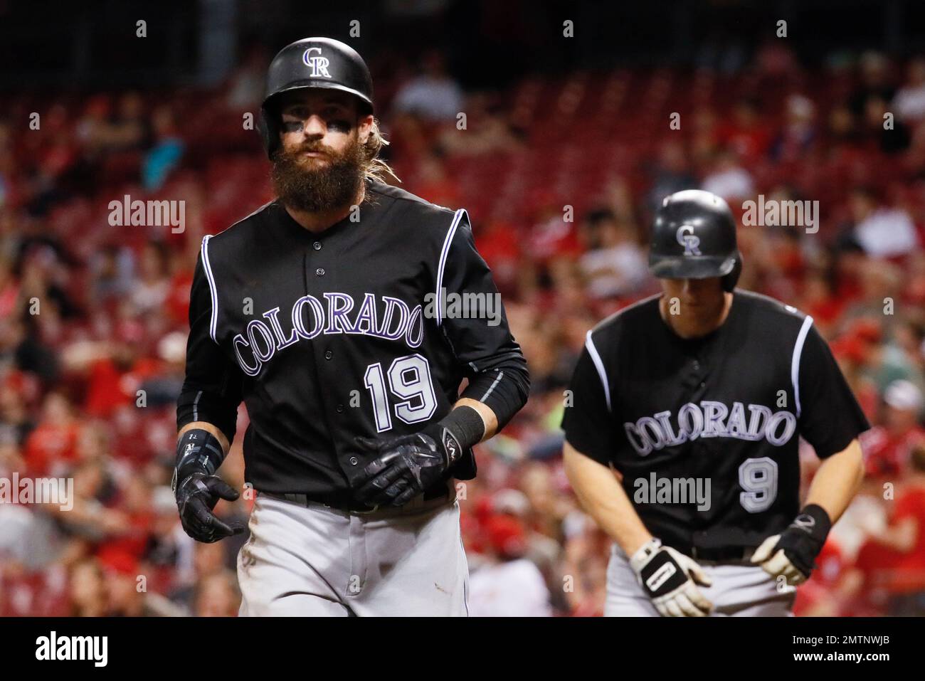 Colorado Rockies' Charlie Blackmon runs back to the dugout after ...