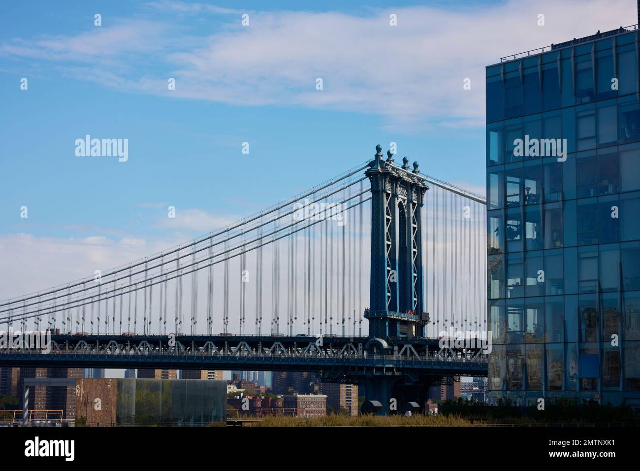 The Manhattan Bridge is a suspension bridge that crosses the East River ...