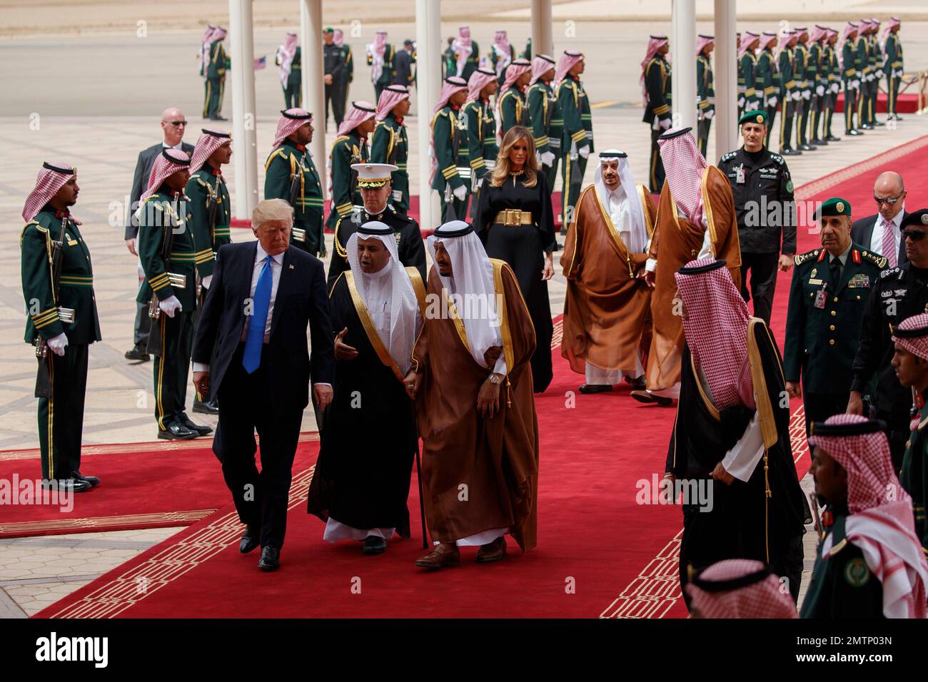 President Donald Trump walks with Saudi King Salman during a welcome ...