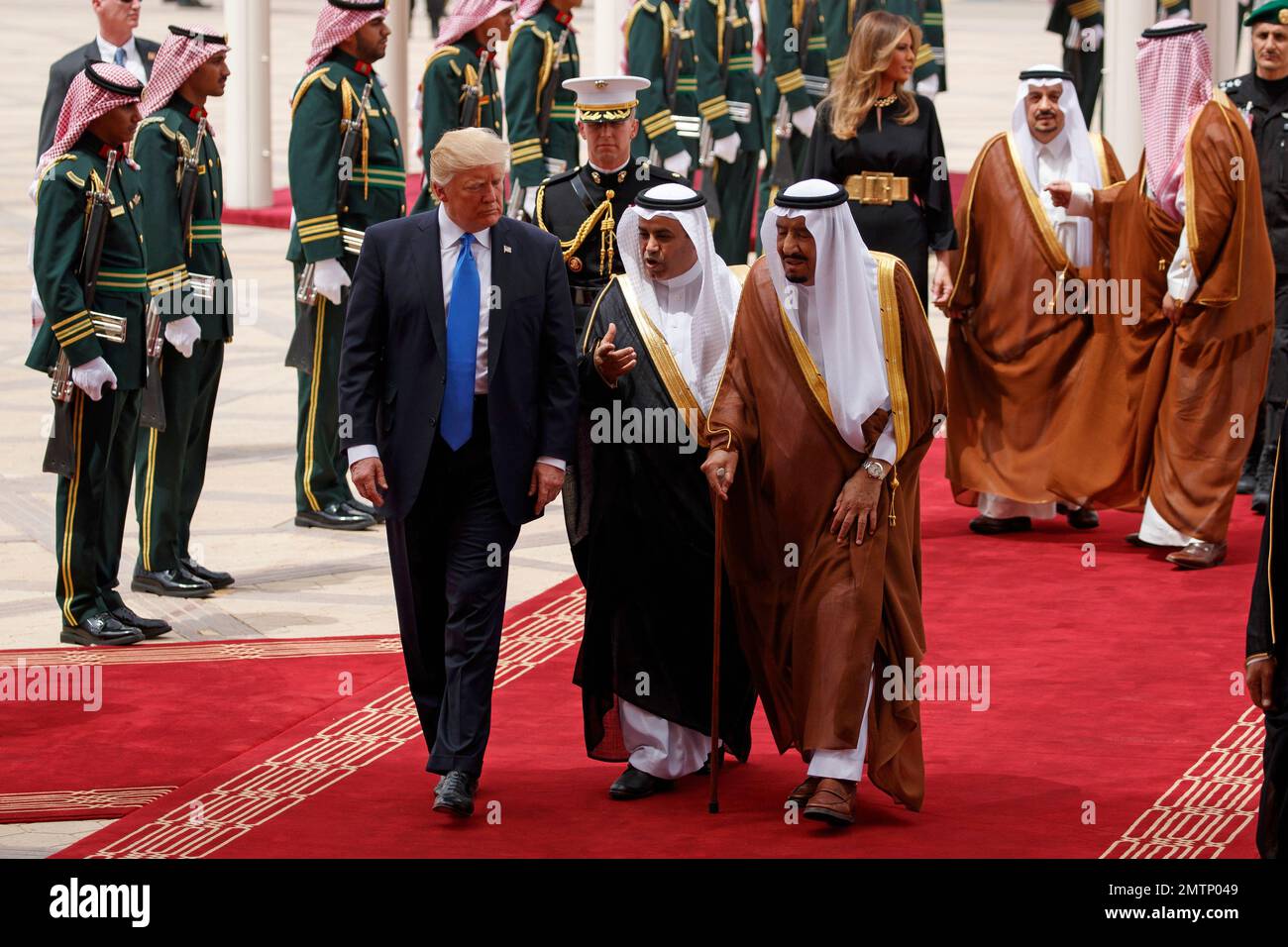 President Donald Trump walks with Saudi King Salman during a welcome ...