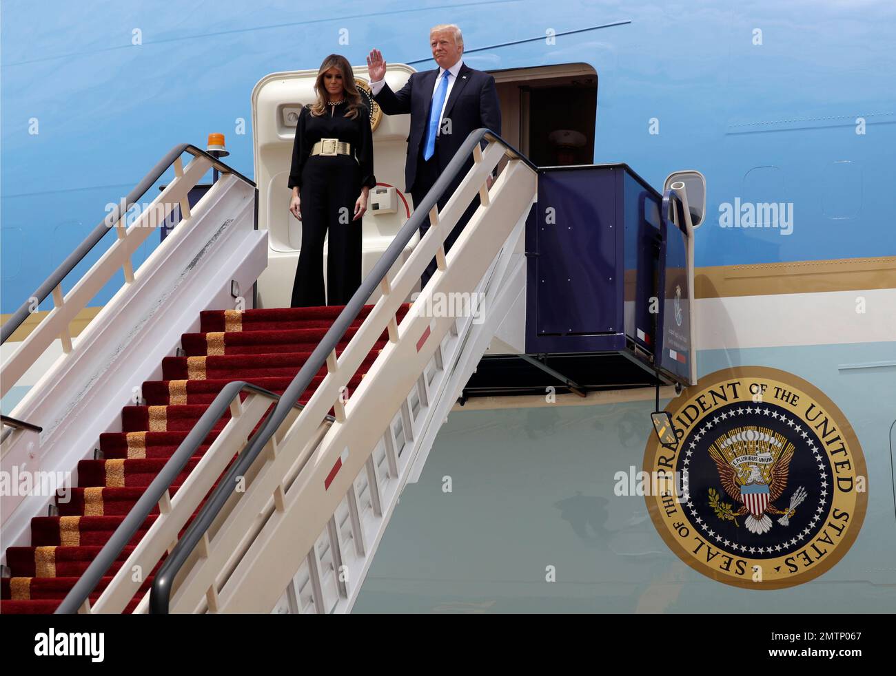 U.S. President Donald Trump, right, and first lady Melania Trump arrive ...
