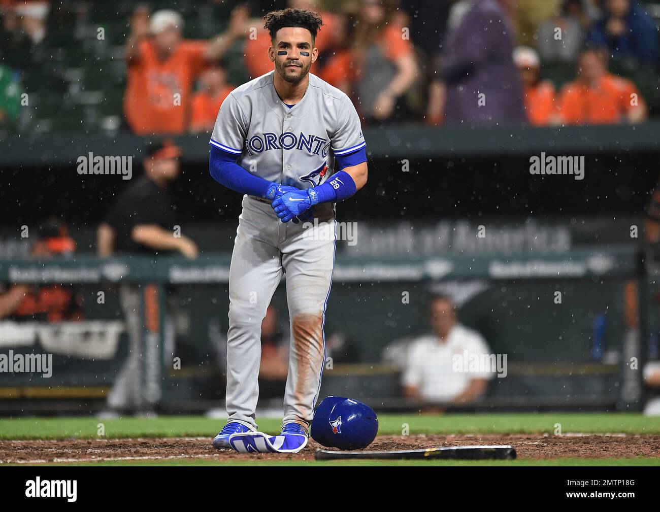 Toronto Blue Jays' Devon Travis reacts after striking out in the rain ...