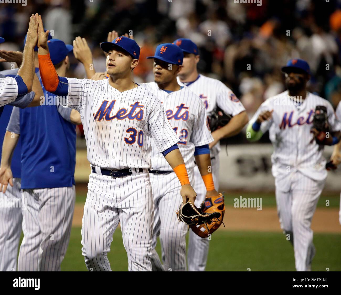 New York Mets' Michael Conforto (30), Juan Lagares (12) and Jose Reyes ...