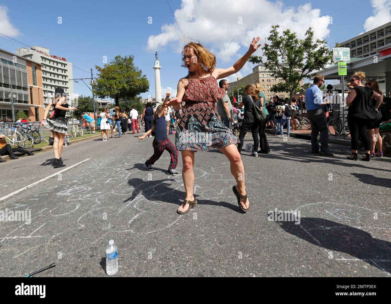 Heather Stanfield dances in the street as workers prepare to take down ...