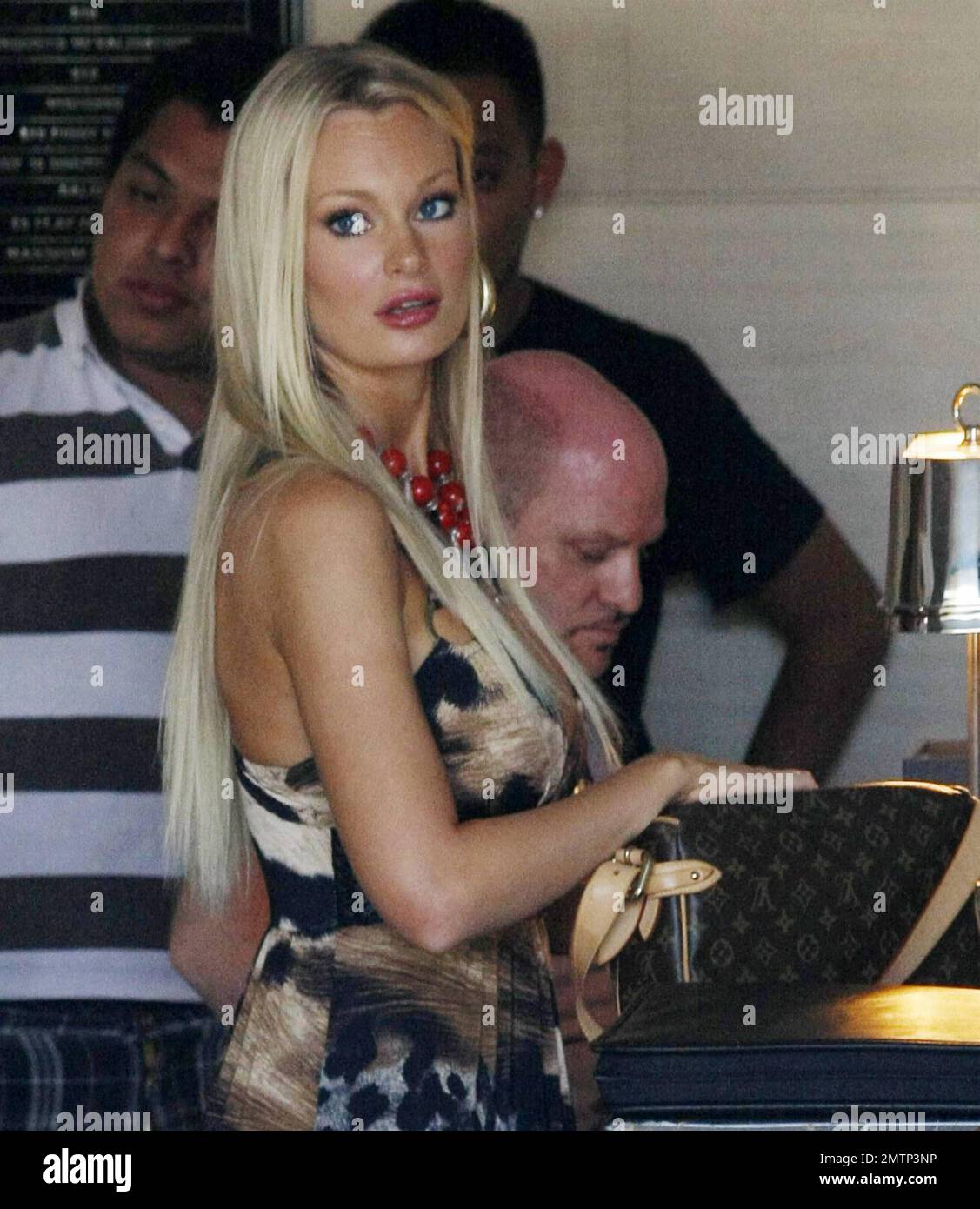 Australian model and actress Sophie Turner pays a valet and poses for ...