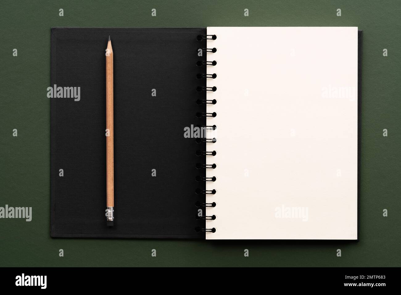 top view open notebook with beige pencil white paper and black copy ...