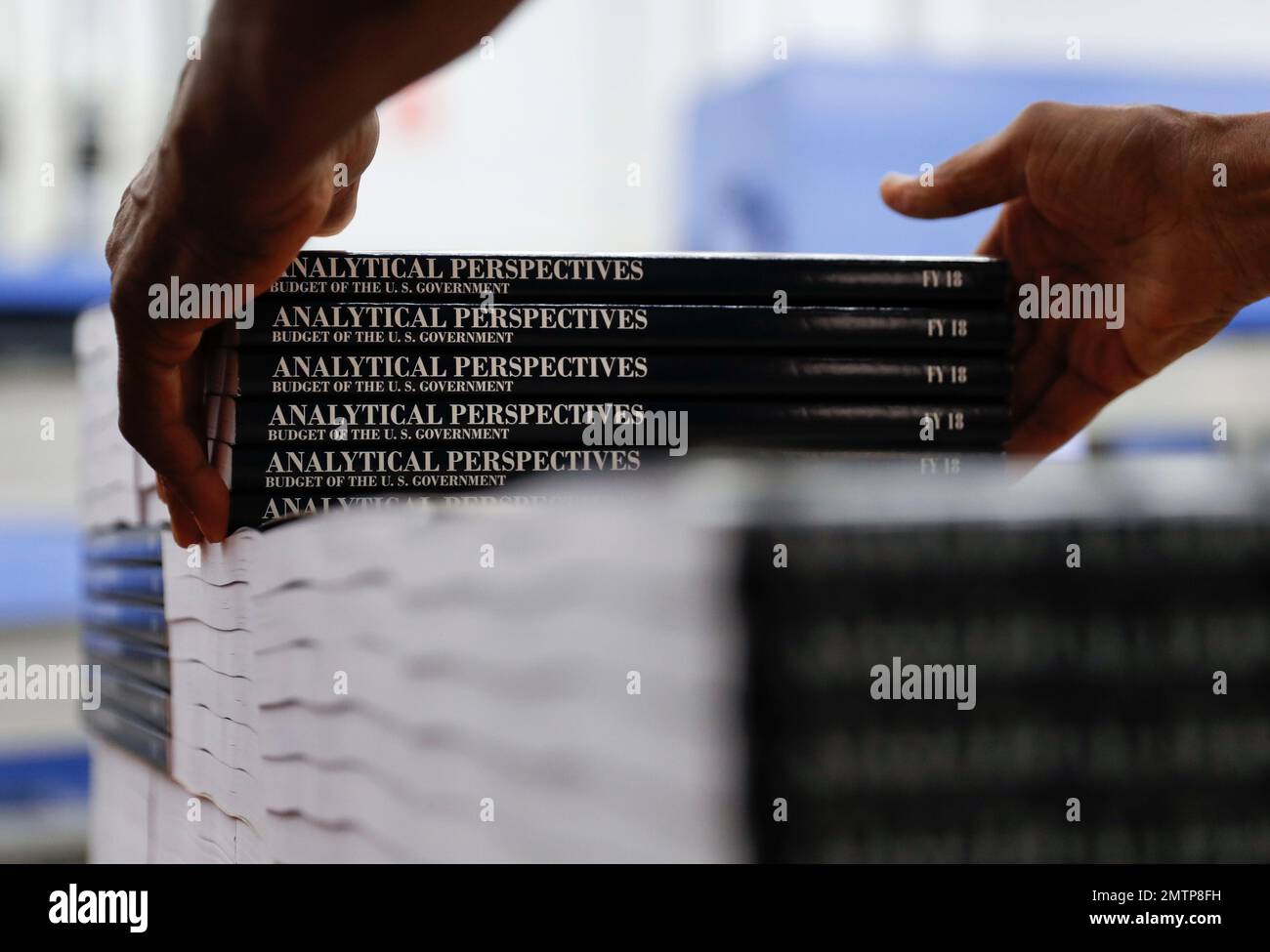 A GPO worker stacks copies of "Analytical Perspectives Budget of the U ...