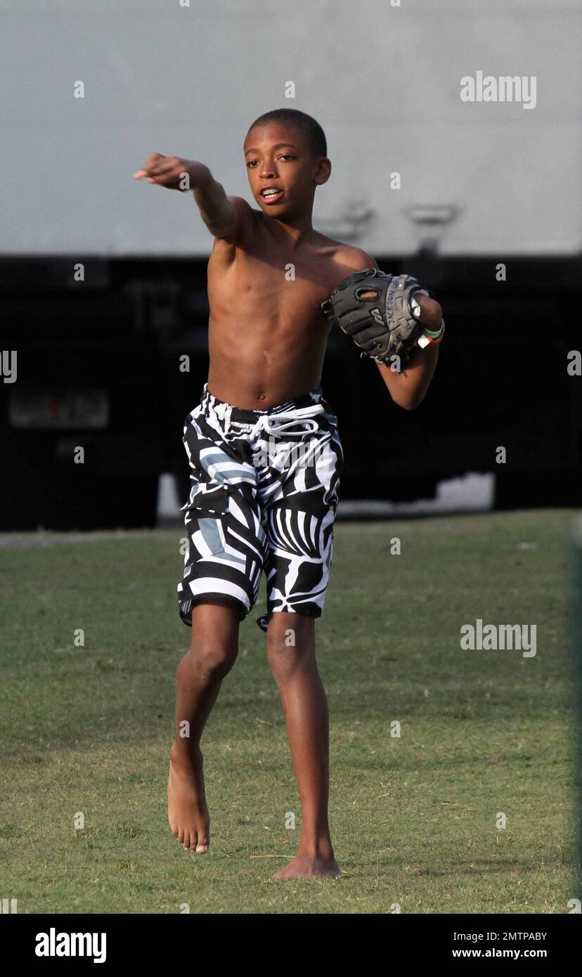 Spike Lee and his son Jackson play a game of catch by the pool of their ...