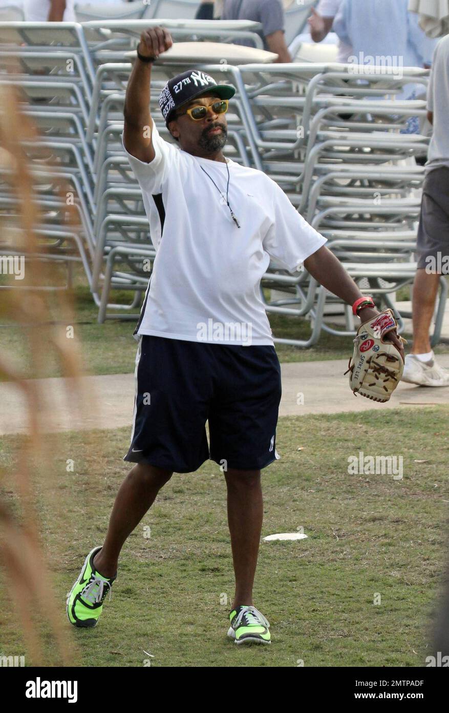Spike Lee and his son Jackson play a game of catch by the pool of their ...