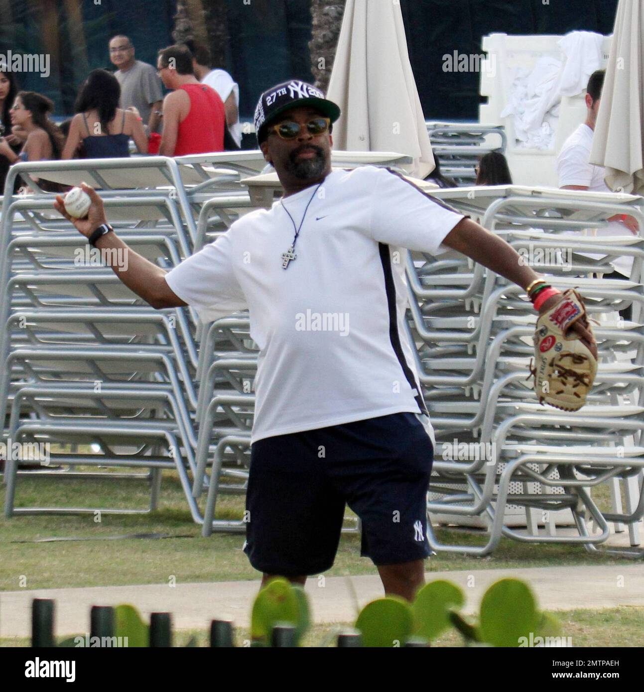 Spike Lee and his son Jackson play a game of catch by the pool of their ...