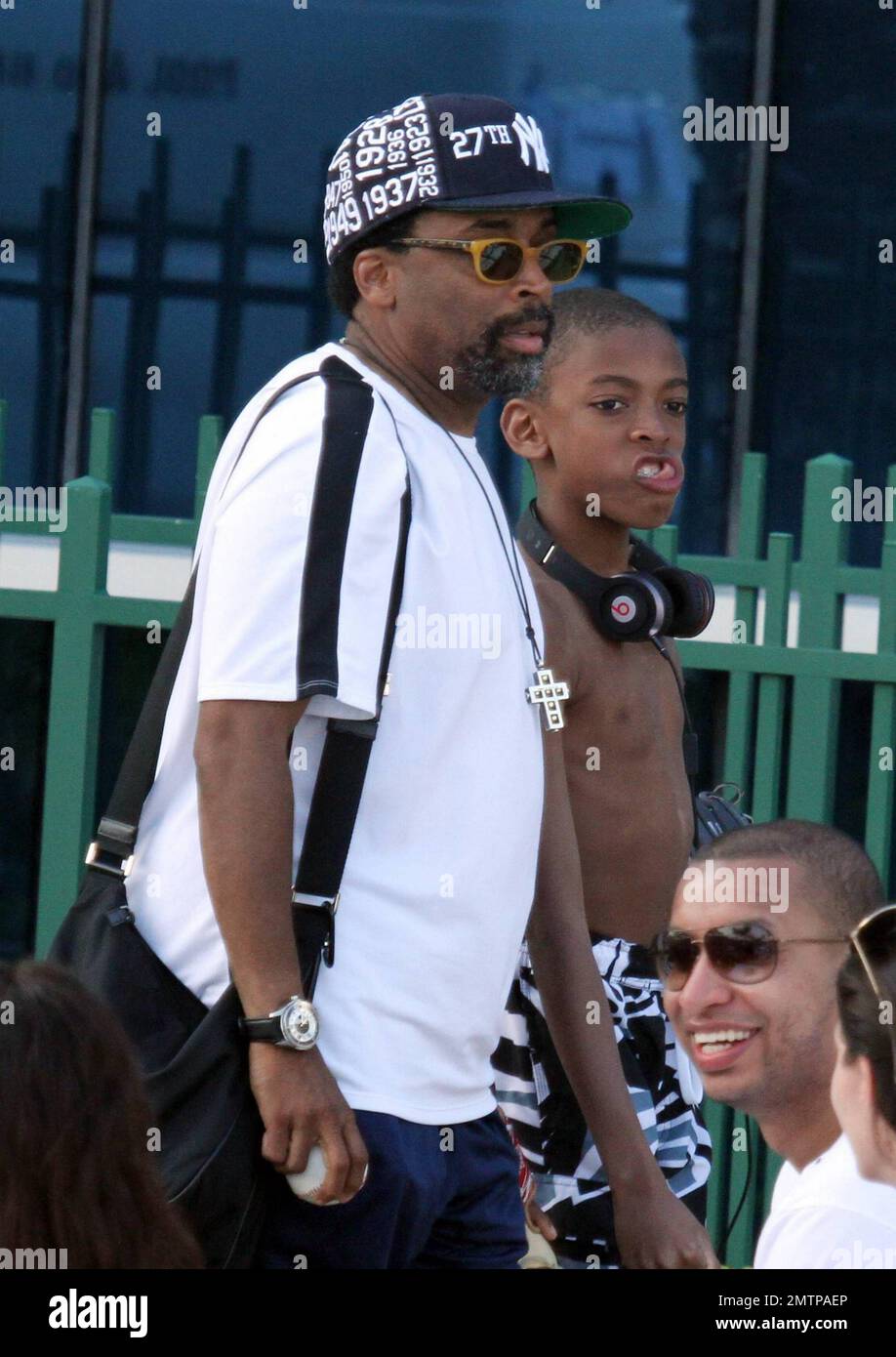 Spike Lee and his son Jackson play a game of catch by the pool of their ...