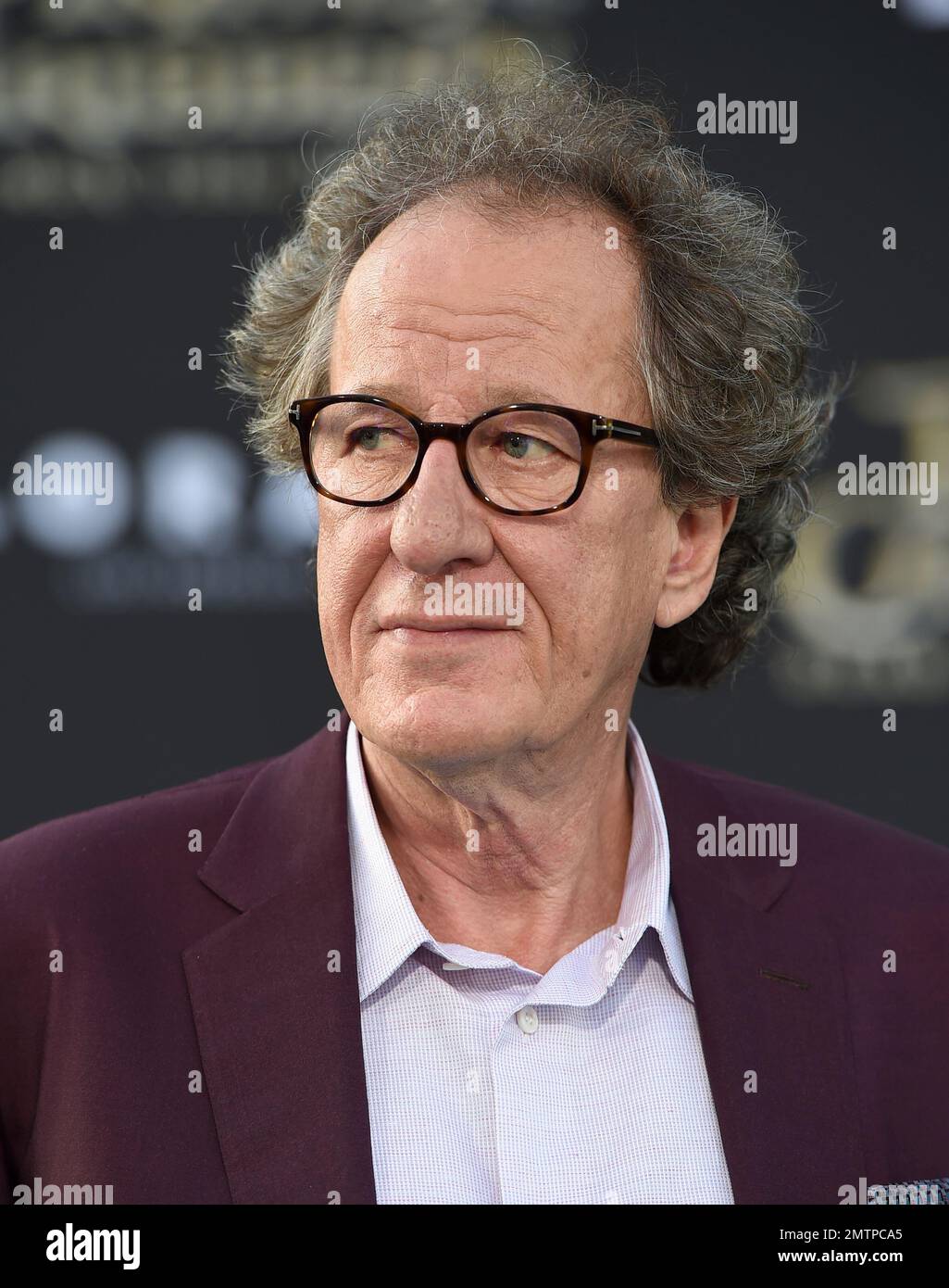 Geoffrey Rush arrives at the Los Angeles premiere of "Pirates of the ...