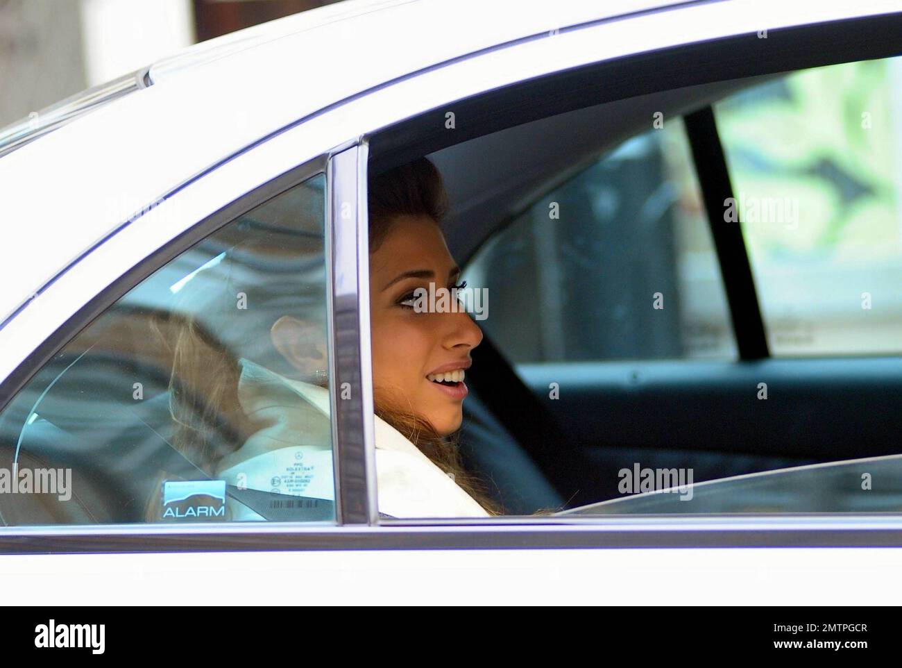 "X Factor" singer Stacey Solomon smiles as her car waits in traffic at ...