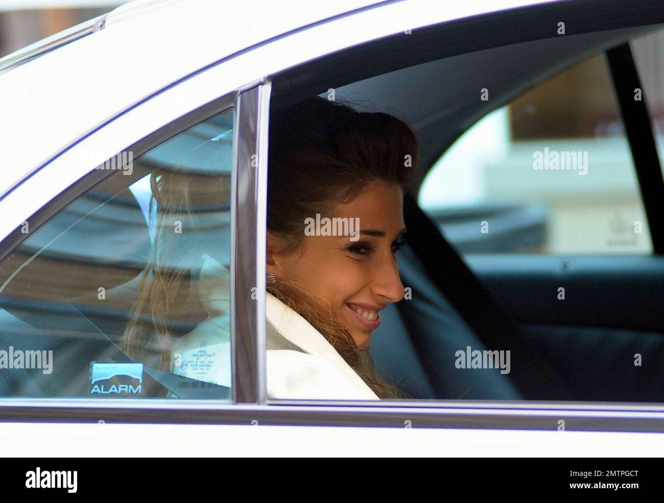 "X Factor" singer Stacey Solomon smiles as her car waits in traffic at ...