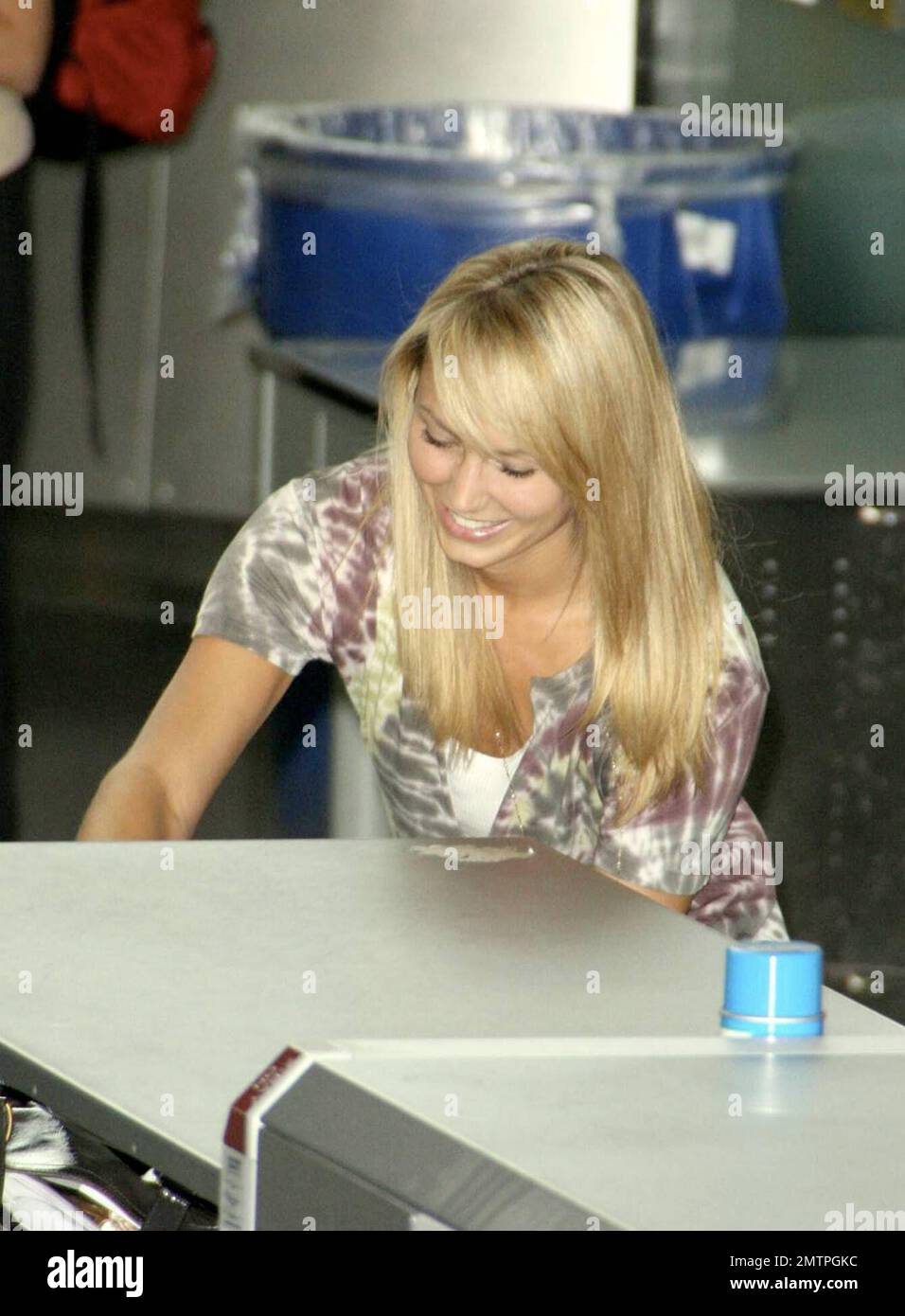 Stacy Keibler and boyfriend Geoff Stults head through an LAX security ...