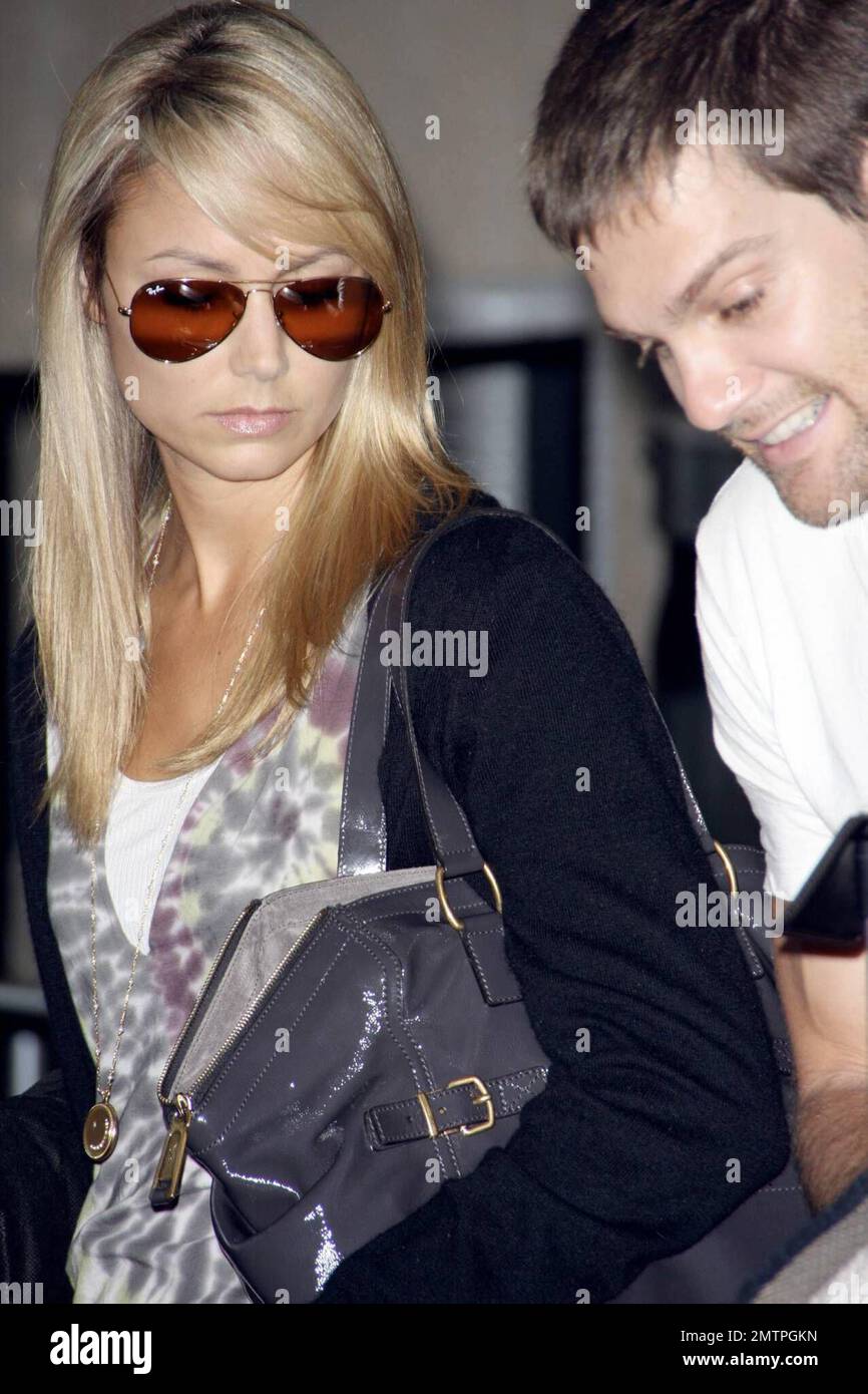 Stacy Keibler and boyfriend Geoff Stults head through an LAX security ...