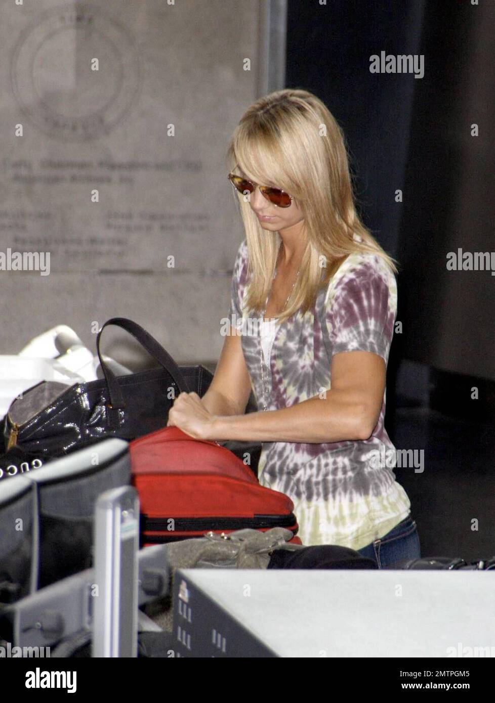 Stacy Keibler and boyfriend Geoff Stults head through an LAX security ...