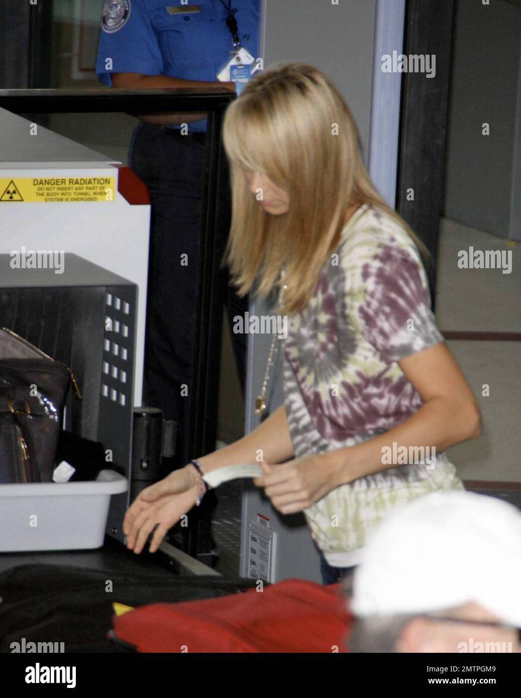 Stacy Keibler and boyfriend Geoff Stults head through an LAX security ...
