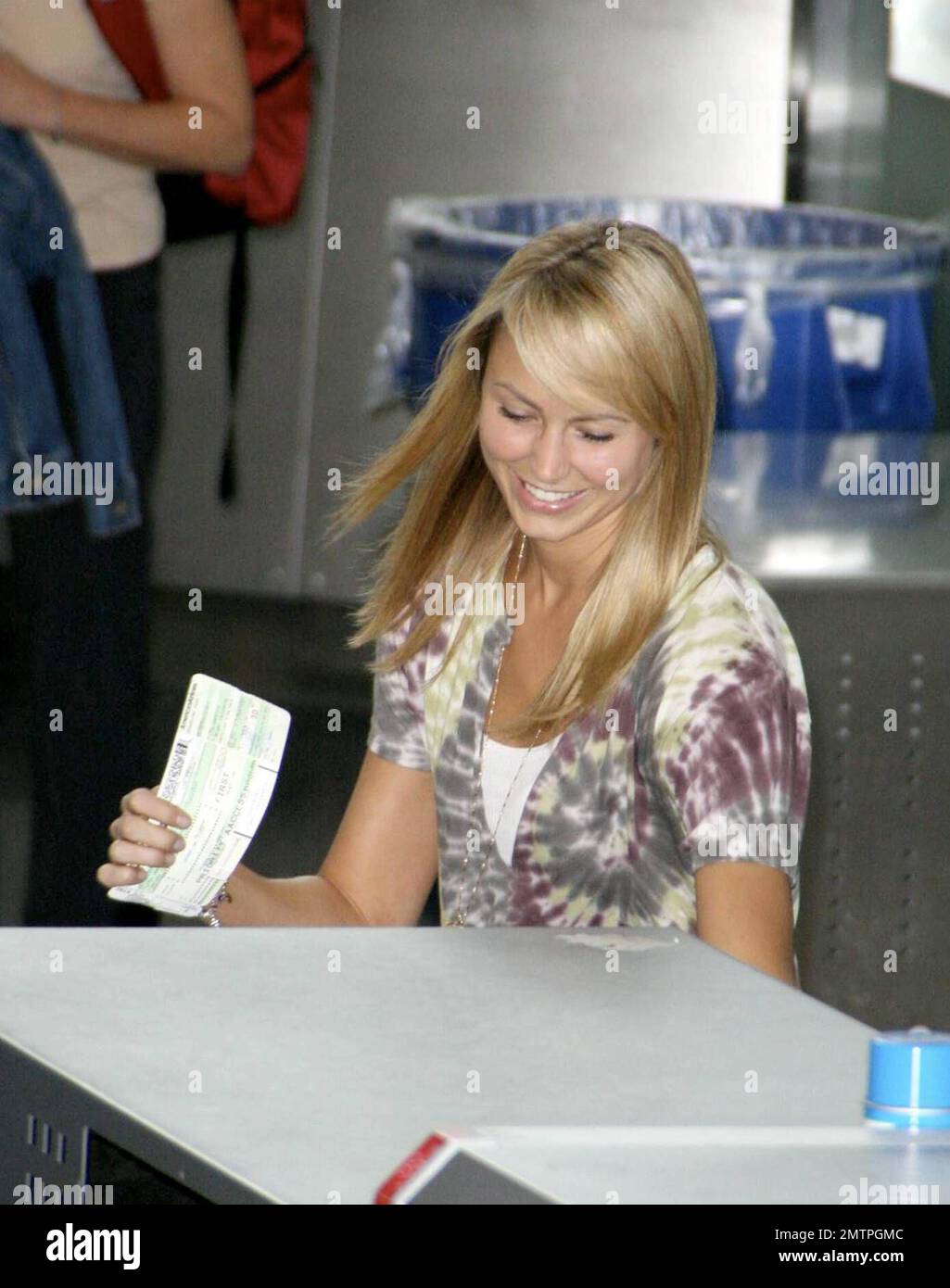 Stacy Keibler and boyfriend Geoff Stults head through an LAX security ...