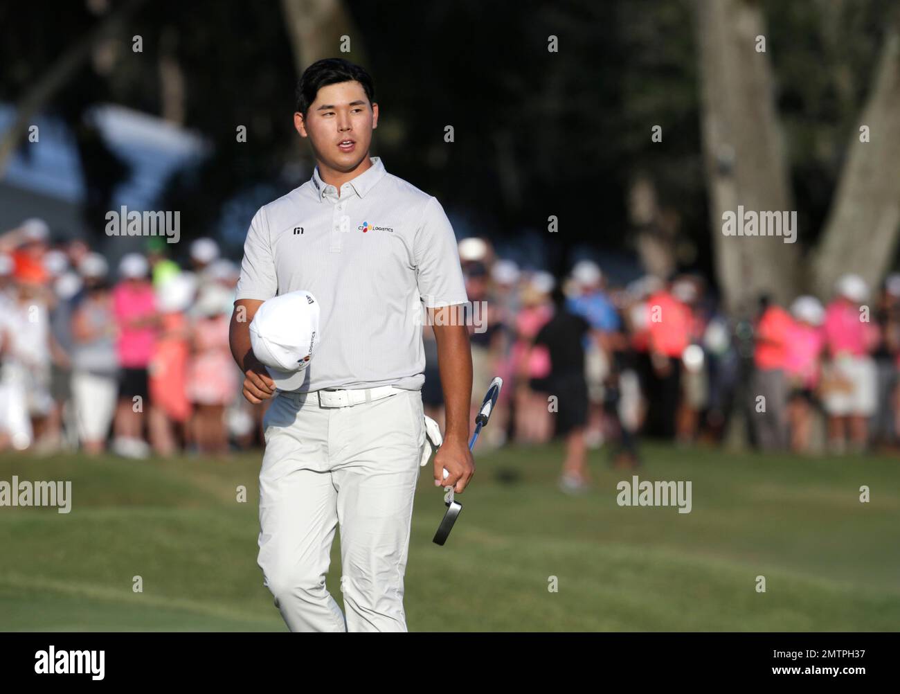 Si Woo Kim, of South Korea, walks off the 18th green after winning The ...