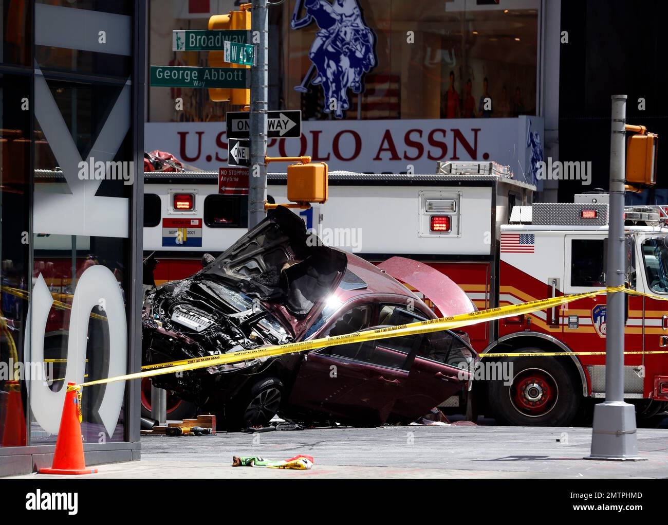 A smashed car sits on the corner of Broadway and 45th Street in New ...