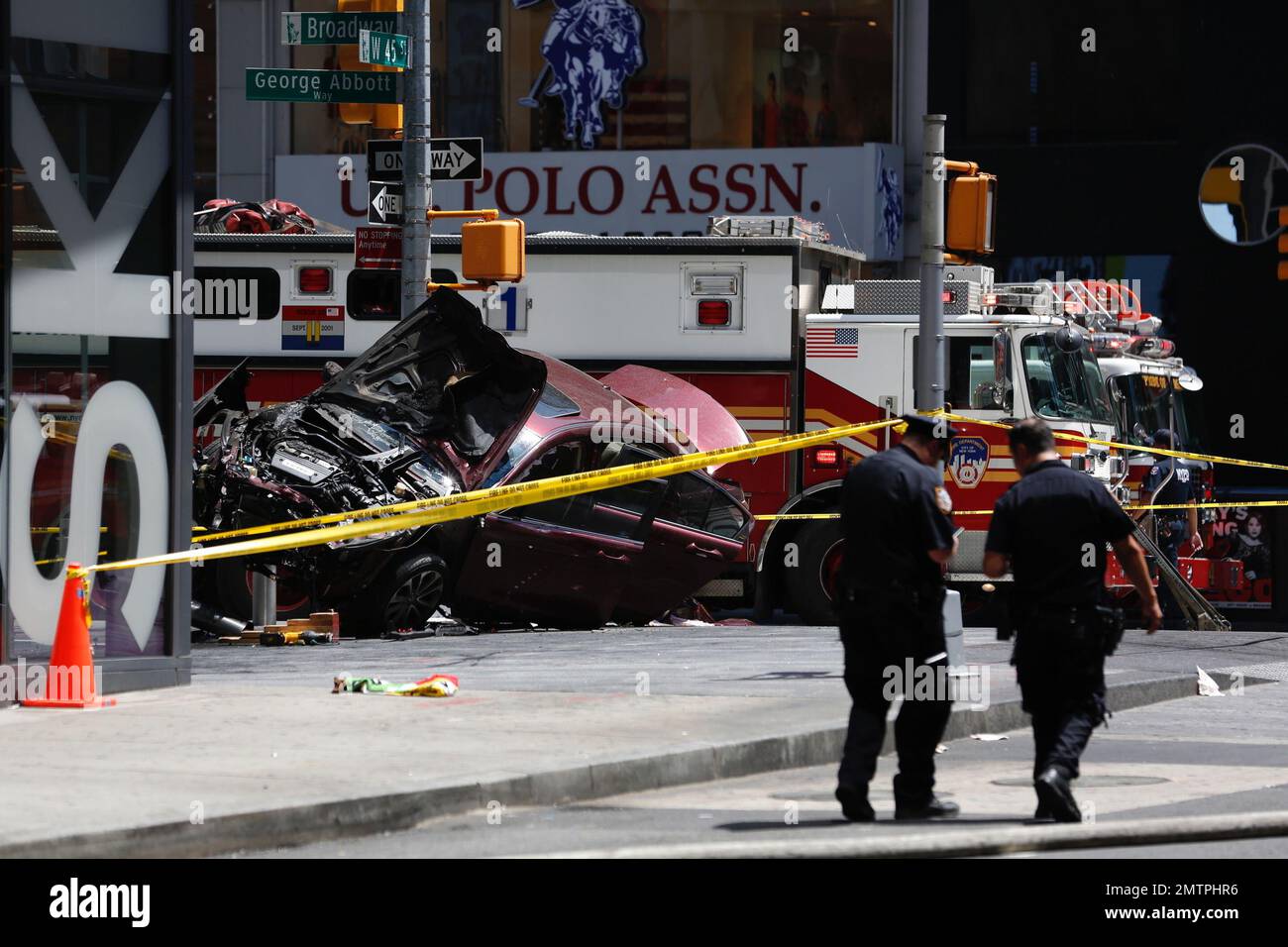 A smashed car sits on the corner of Broadway and 45th Street in New ...