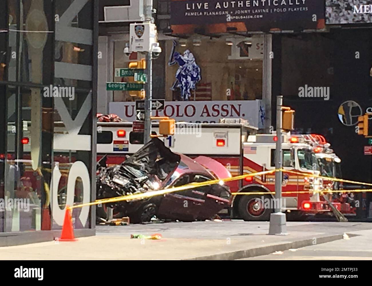 A smashed car sits on the corner of Broadway and 45th Street in New ...