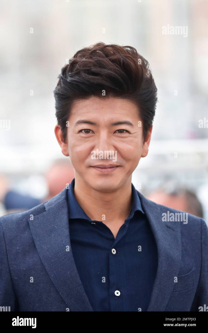 Actor Takuya Kimura poses for photographers during the photo call for ...