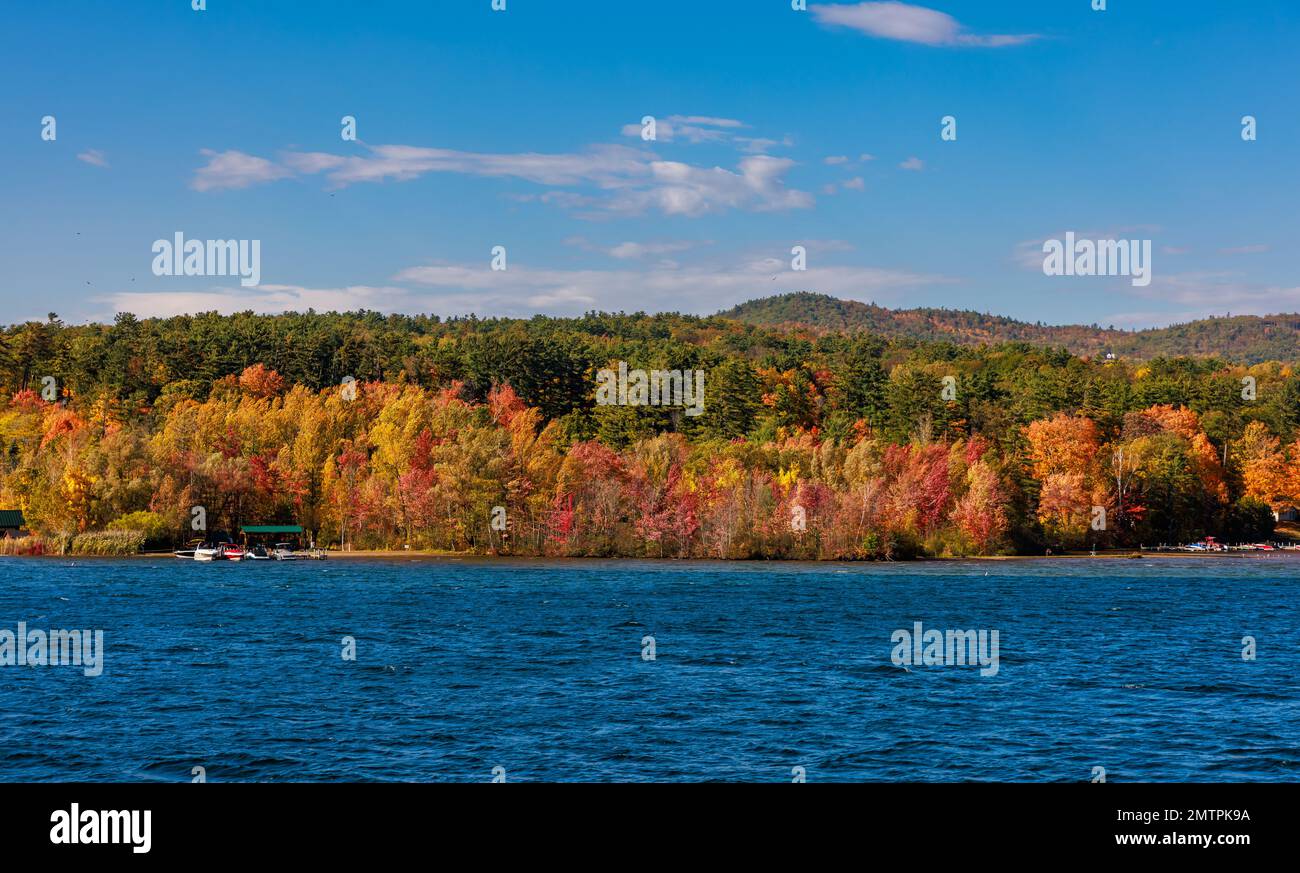 A landscape scene of Lake George coast with forest autumn trees and ...