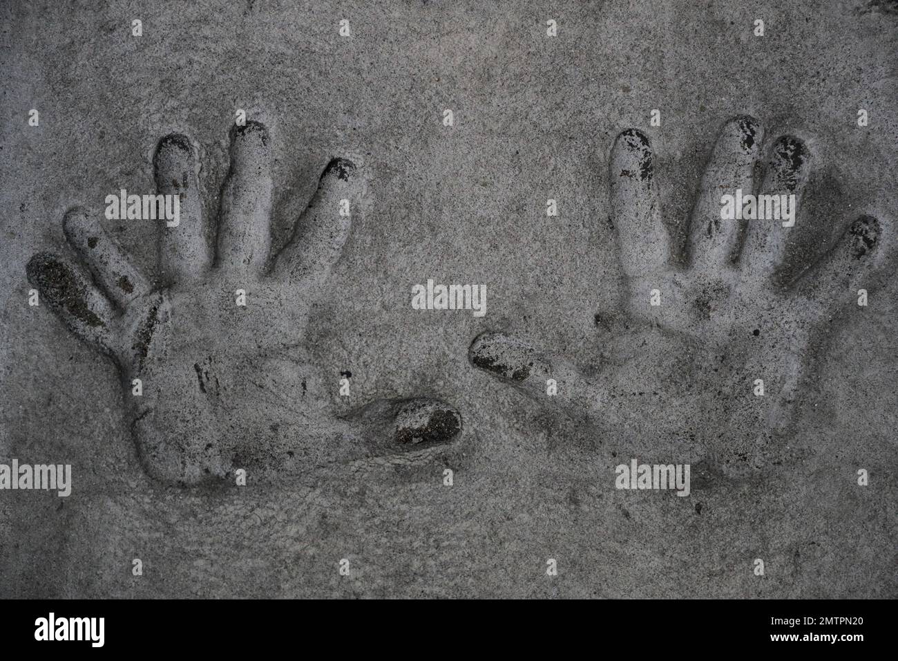 In this May 15, 2017 photo, a six-finger handprint, left, appears with ...