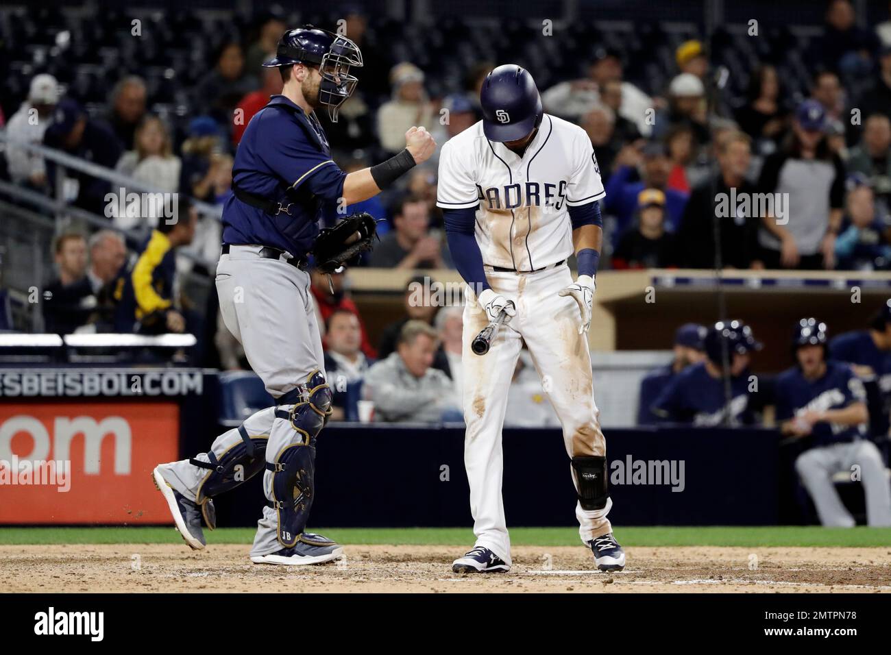 Milwaukee Brewers catcher Jett Bandy, left, reacts after San Diego ...