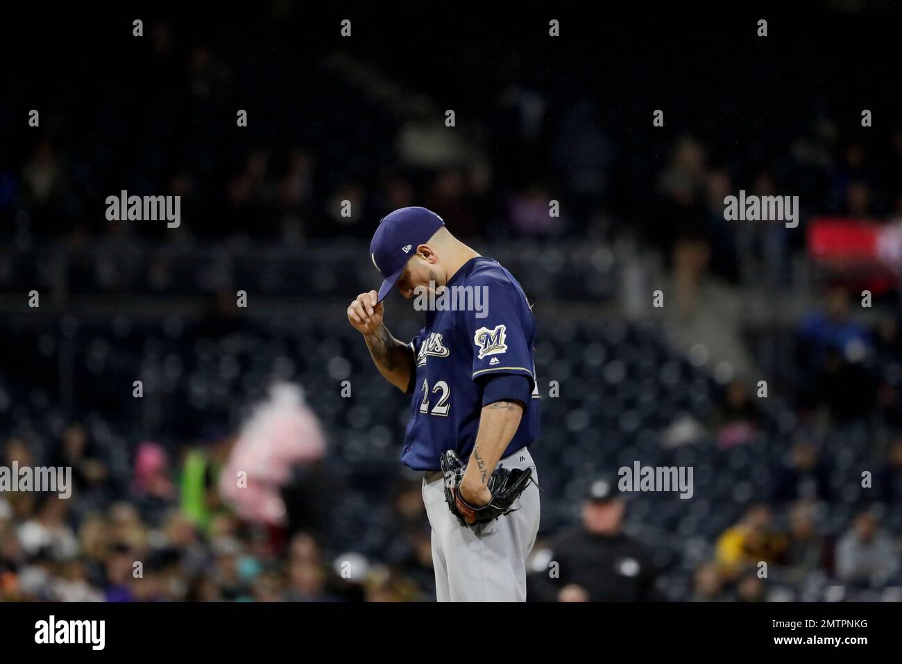 Milwaukee Brewers starting pitcher Matt Garza adjusts his cap during ...