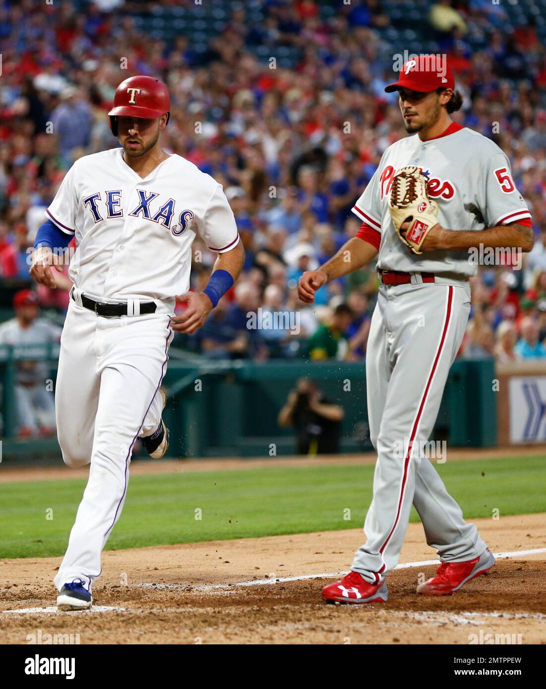 Texas Rangers' Joey Gallo, left, scores on a wild pitch thrown by ...