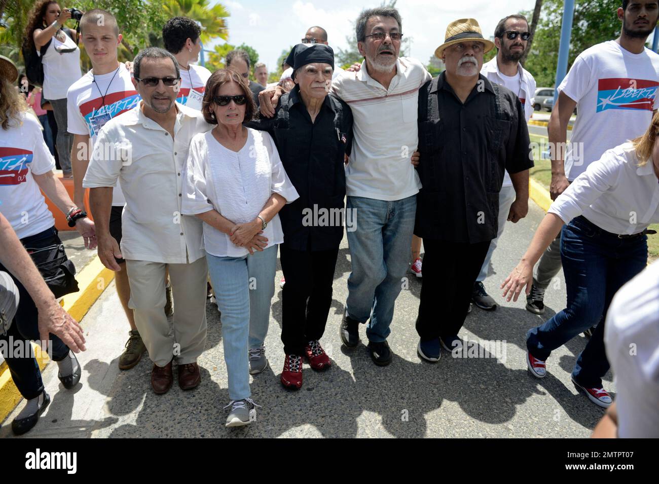 CORRECTS ORDER OF NAMES - Former prisoners, from left, Luis Rosa ...
