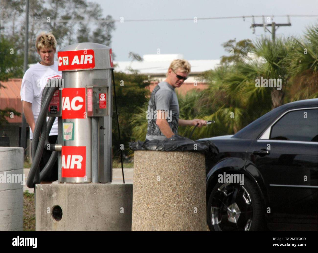 Exclusive!! German soccer ace Stefan Effenberg helps his son put air in ...