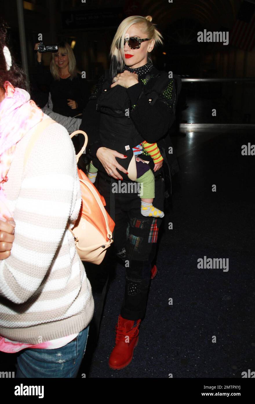 Gwen Stefani with baby Apollo at LAX airport. Gwen is reportedly ...