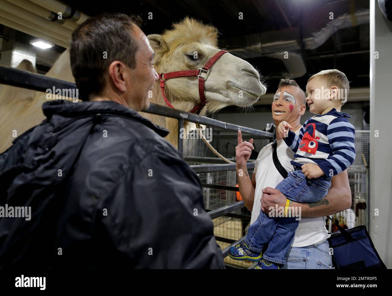 Ringling Bros. boss clown Sandor Eke, center, holds his 2-year-old son ...