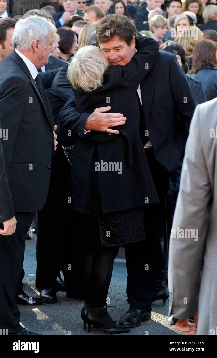 Stephen Gately's mother Margaret is comforted by friends and family as ...