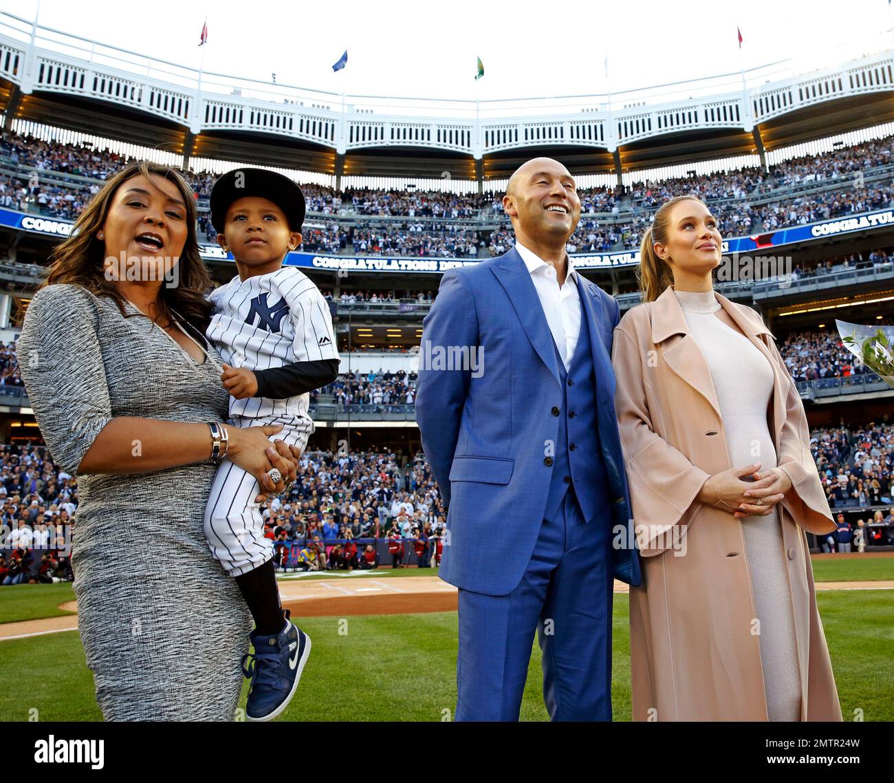Derek Jeter's sister Sharlee Jeter, left, holds her son Jaden, as ...