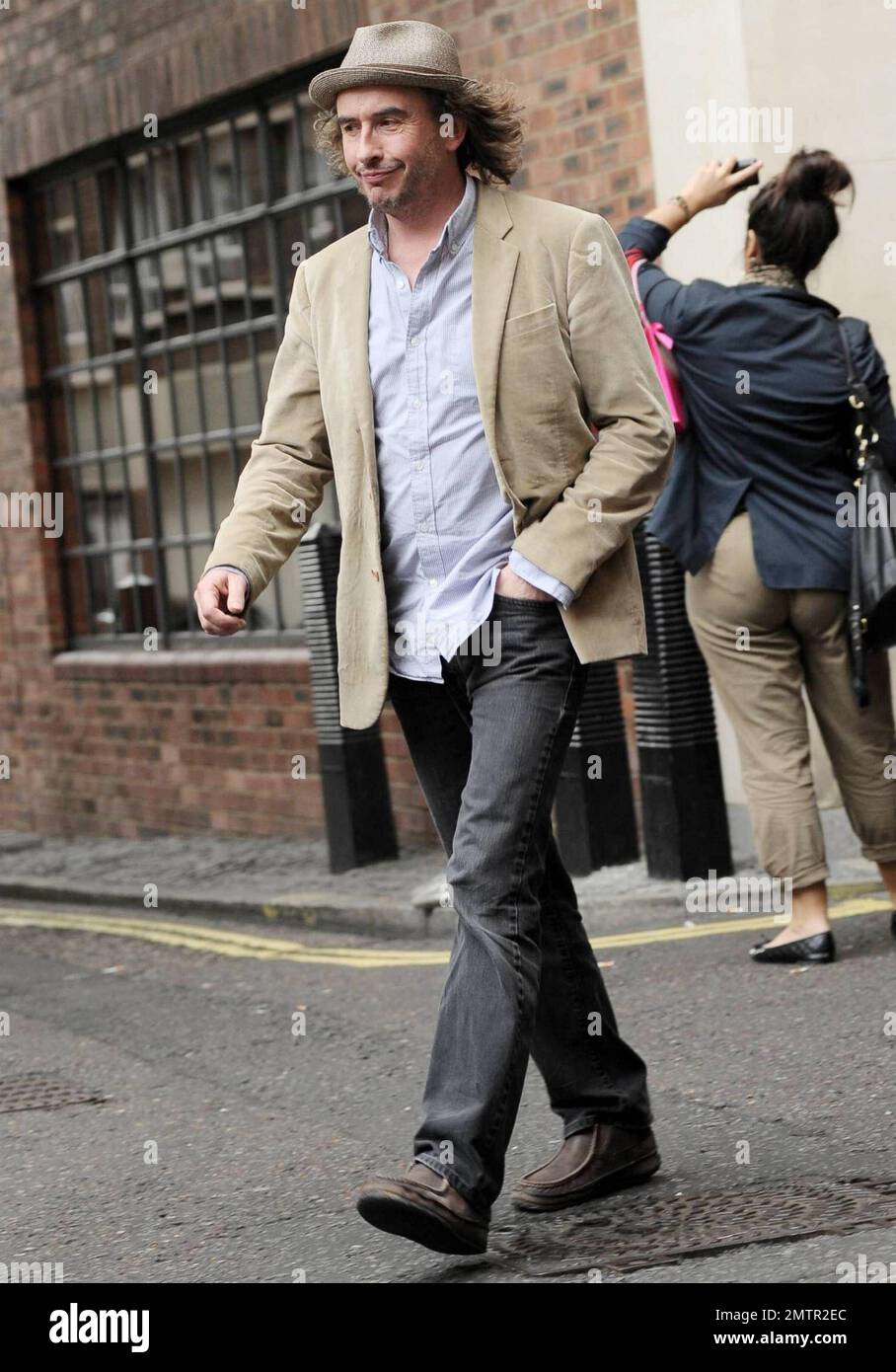 Actor, comedian, writer and producer Steve Coogan shows off his long ...