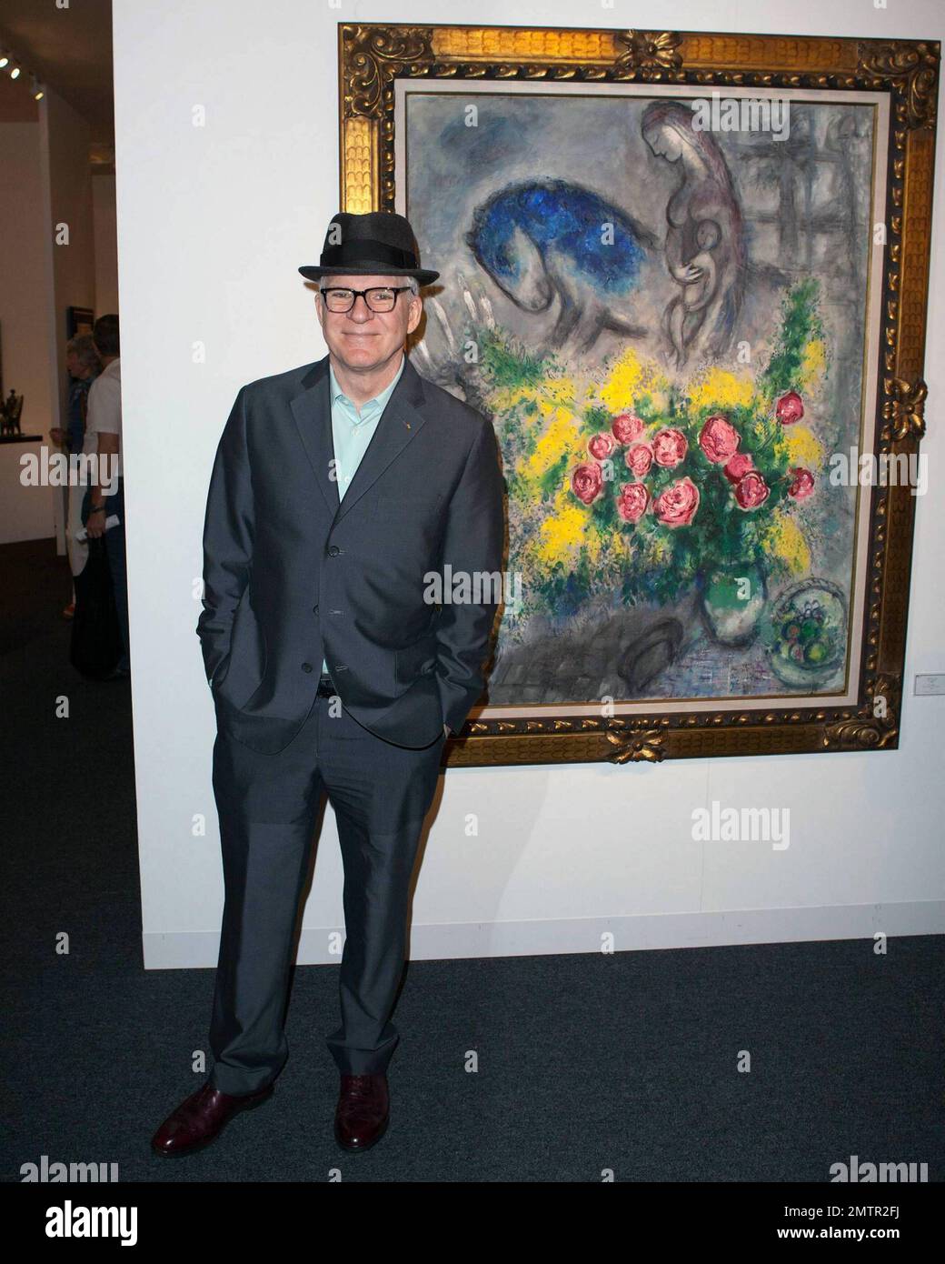 Actor, comedian and musician Steve Martin poses for photos while ...