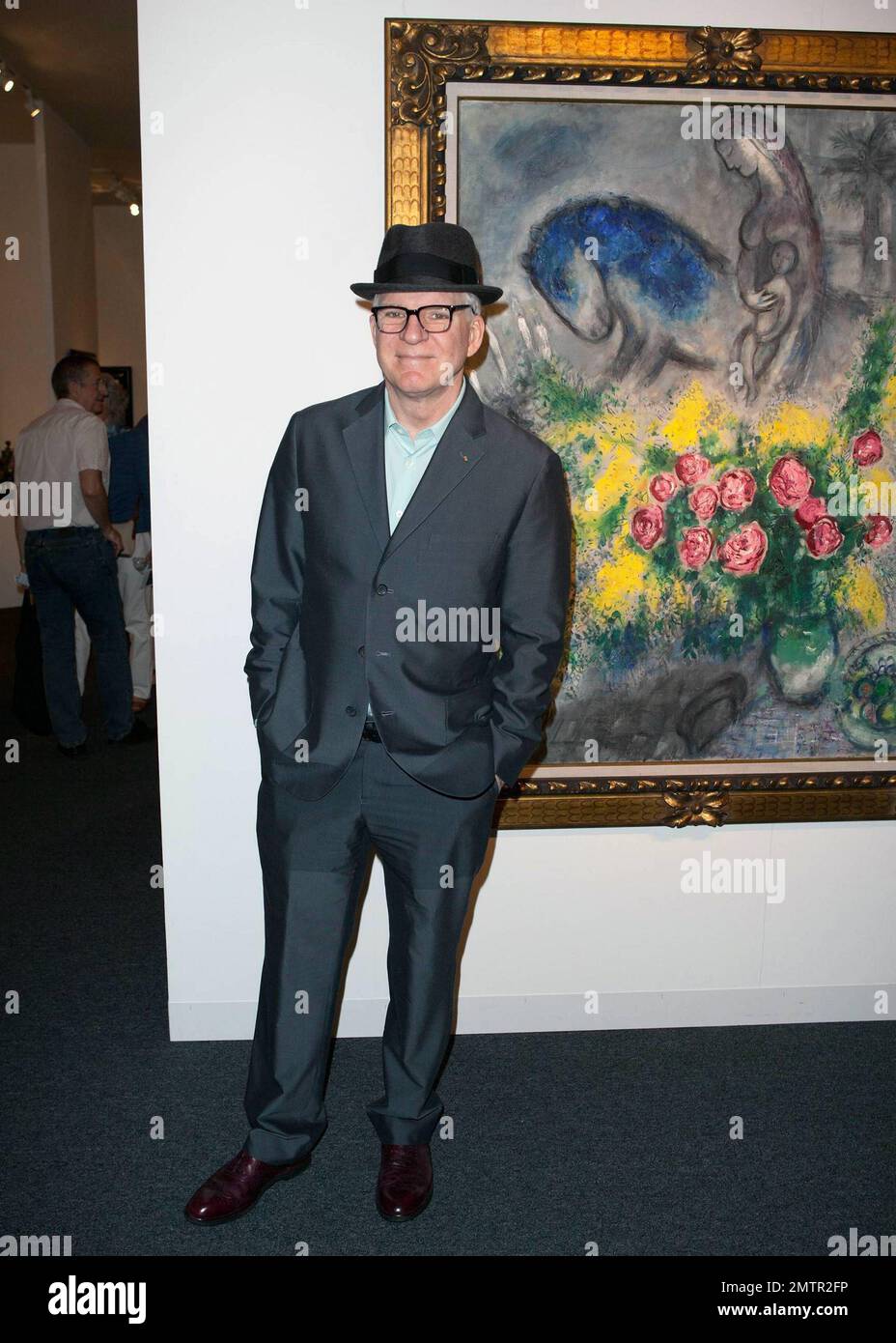 Actor, comedian and musician Steve Martin poses for photos while ...